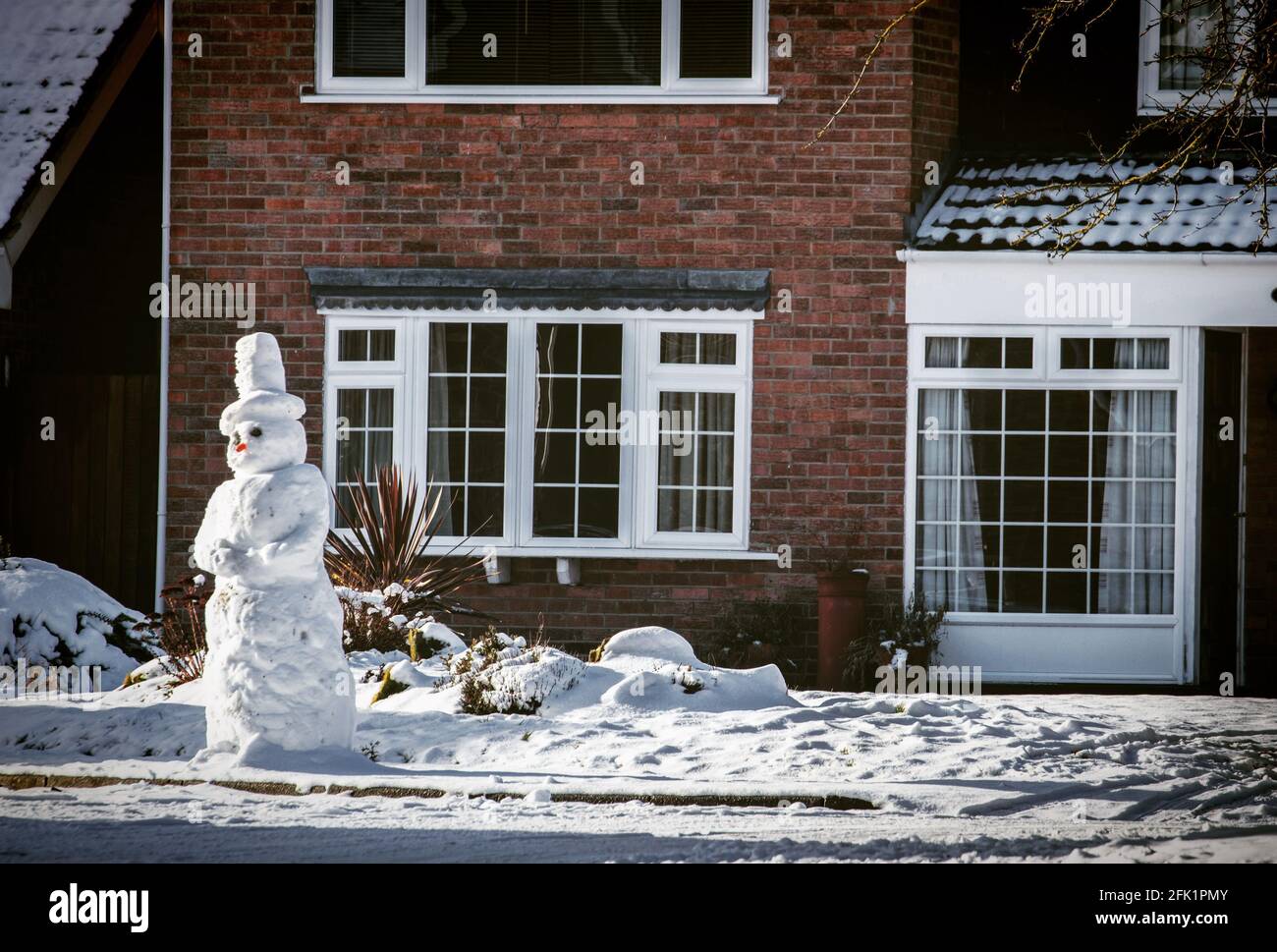 Snowman on a Street Corner Stock Photo - Alamy