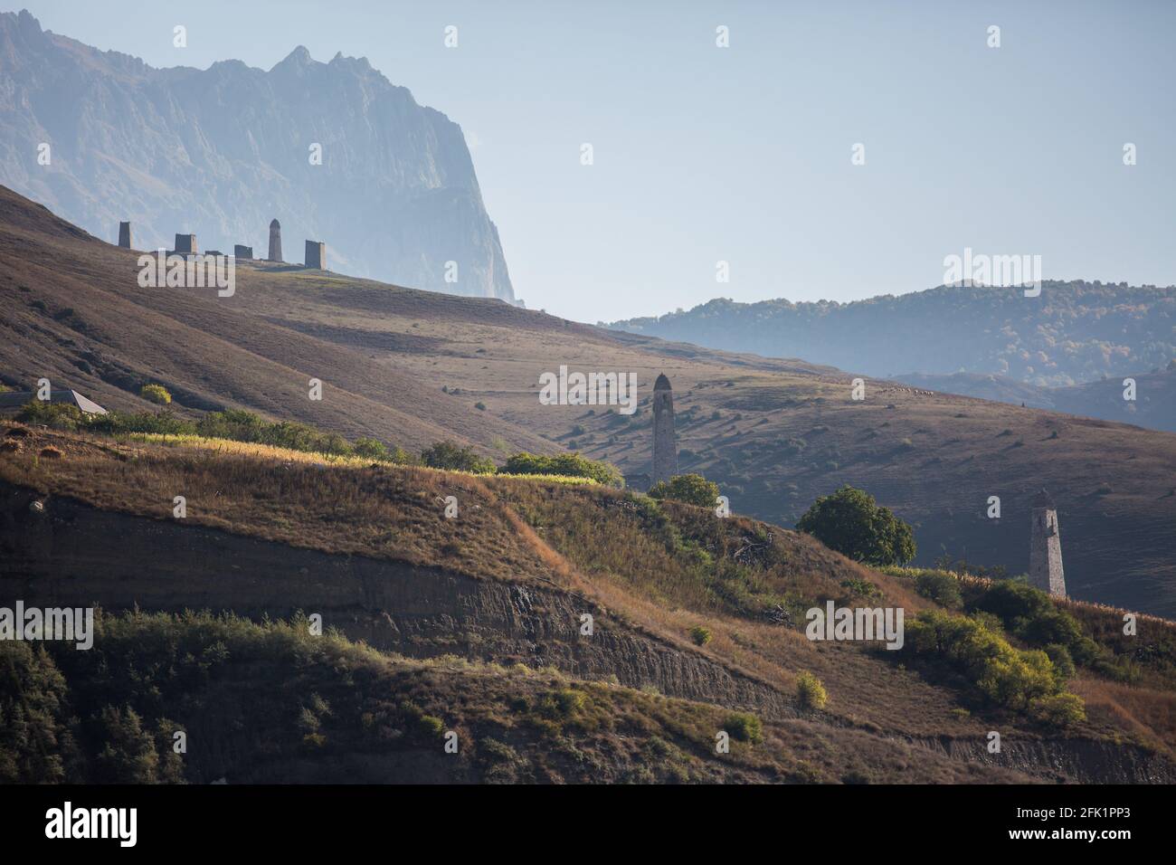 Landscape autumn view of medieval ancient stone battle tower complex in ...
