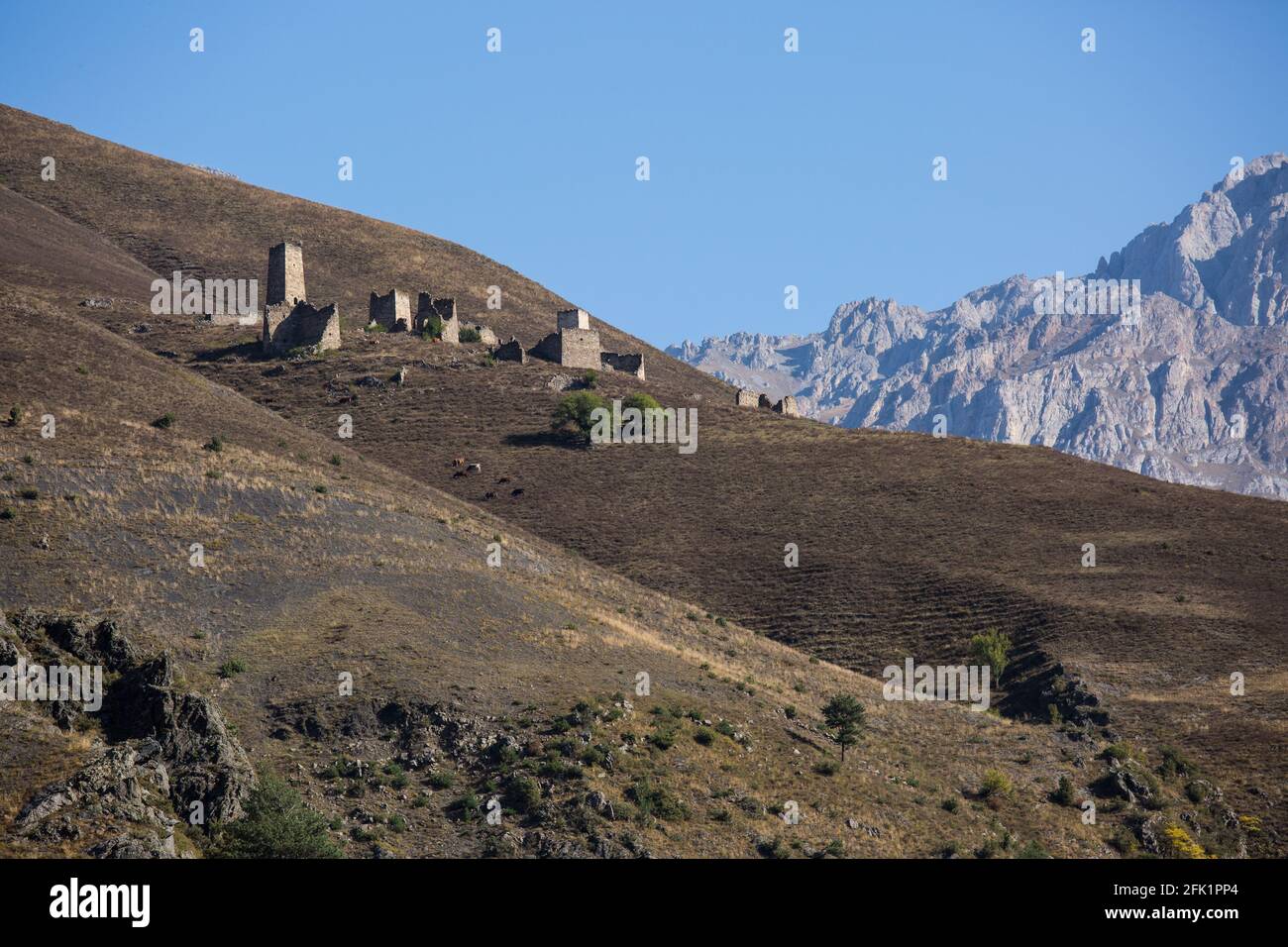 Landscape autumn view of medieval ancient stone battle tower complex in ...