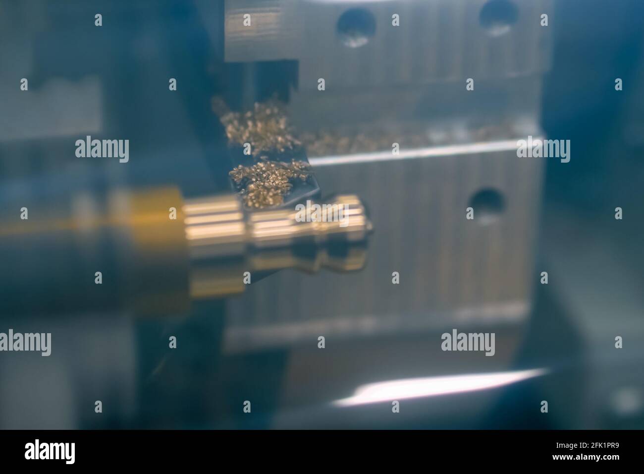 Automated CNC lathe machine cutting rotating metal workpiece - close up ...