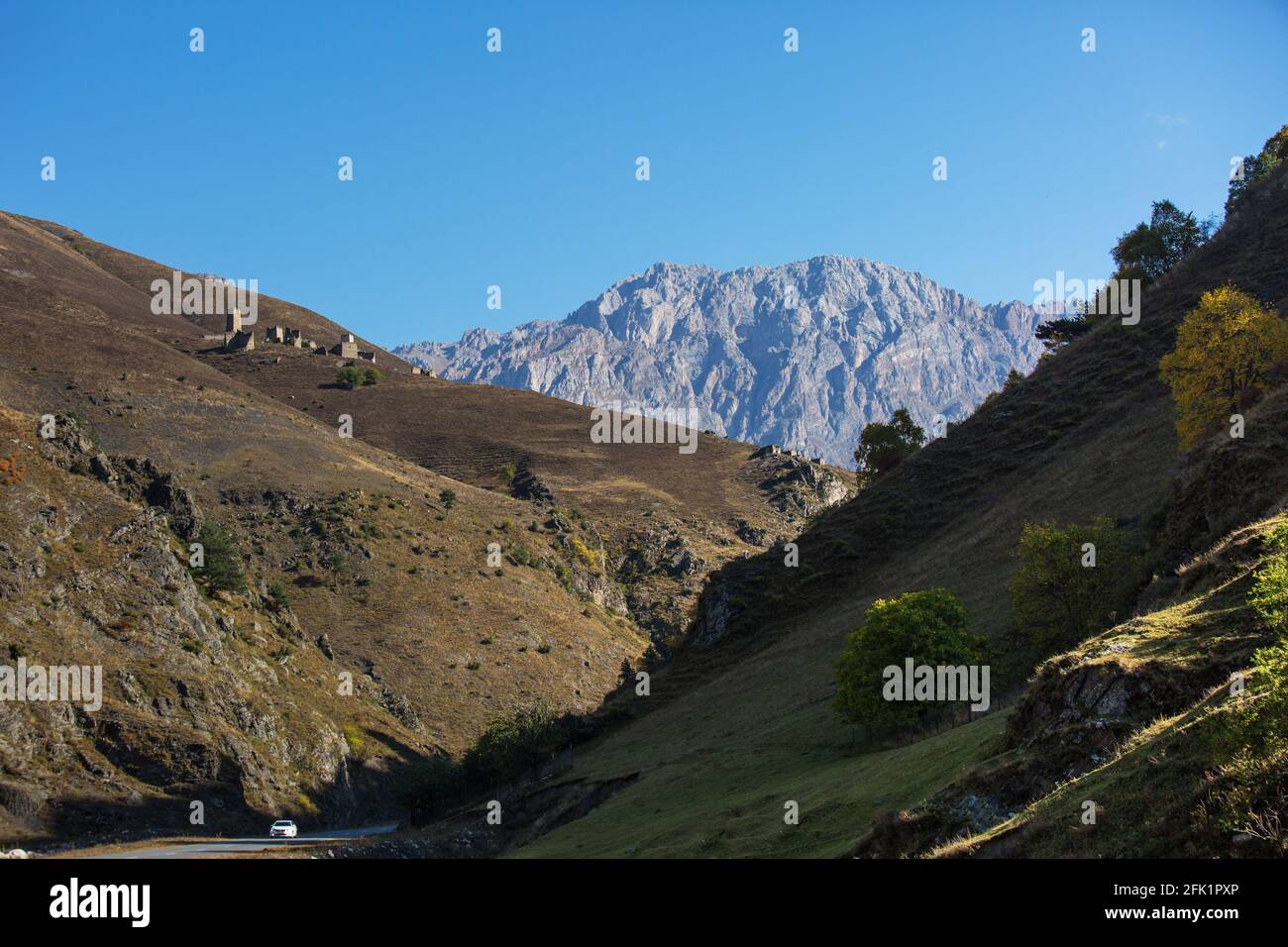 Landscape autumn view of medieval ancient stone battle tower complex in ...