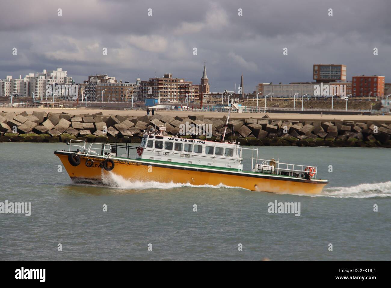 Charter fishing boat is leaving the harbor of Scheveningen heading ...