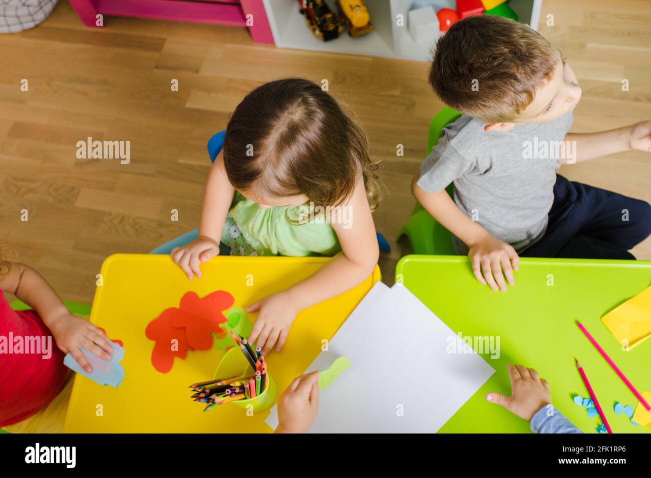 Top view kindergarten children during art lesson Stock Photo - Alamy