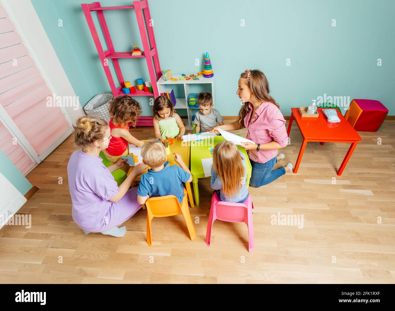 Top view kindergarten children during art lesson Stock Photo - Alamy