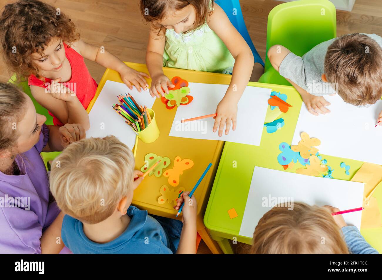 Top view kindergarten children during art lesson Stock Photo - Alamy