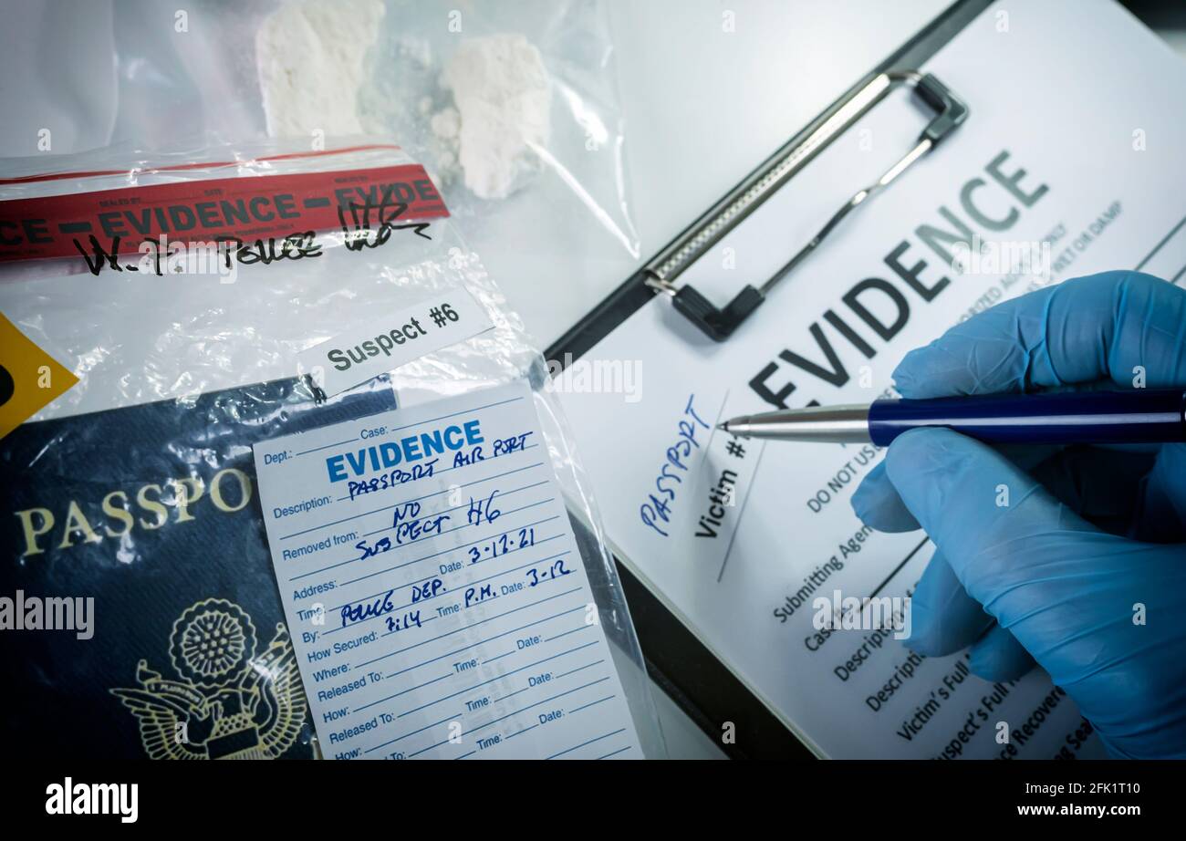 Police criminologist working on drug interception, conceptual image ...