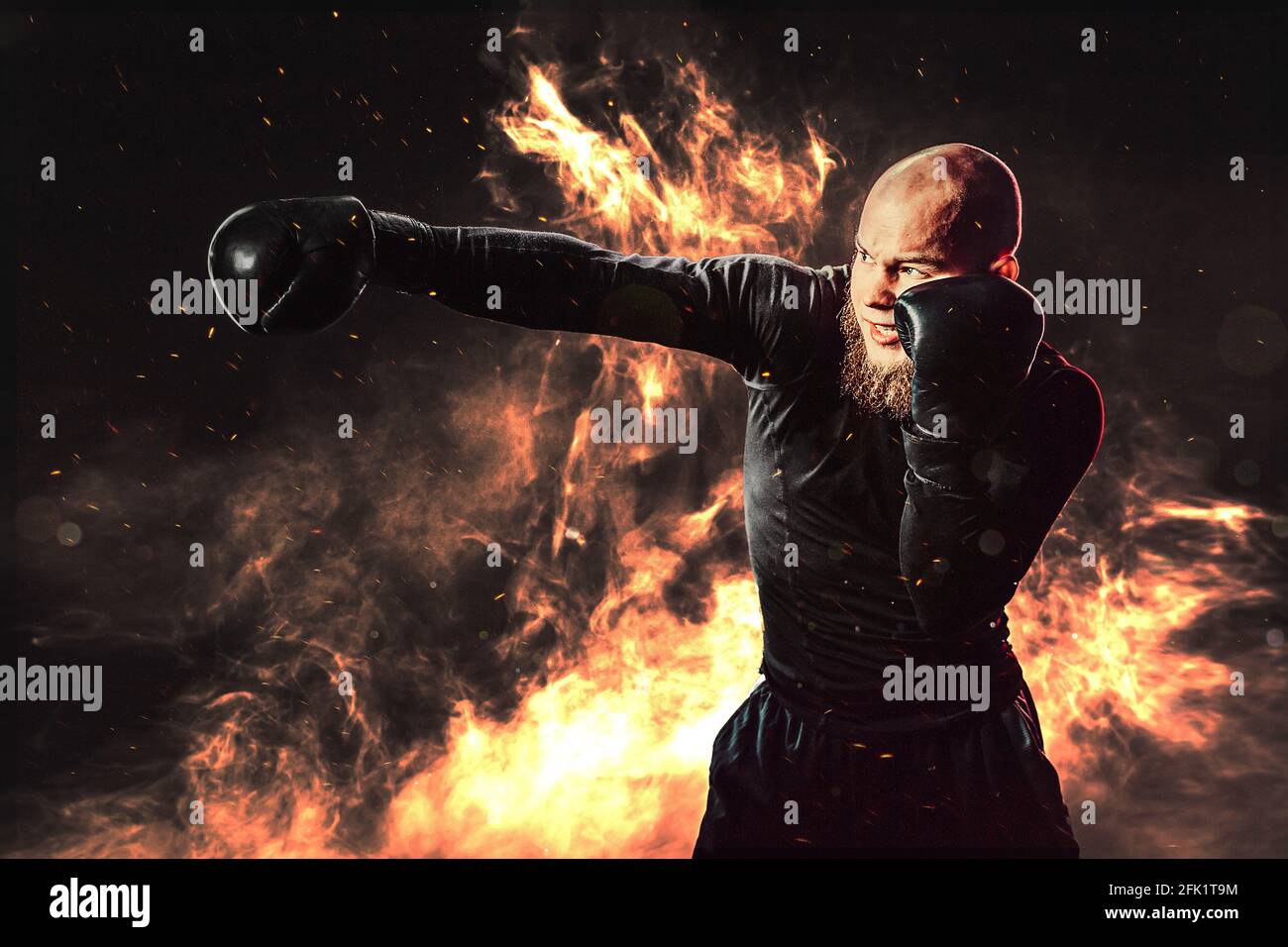 Sportsman boxer training, hitting direct hit on background with Stock ...