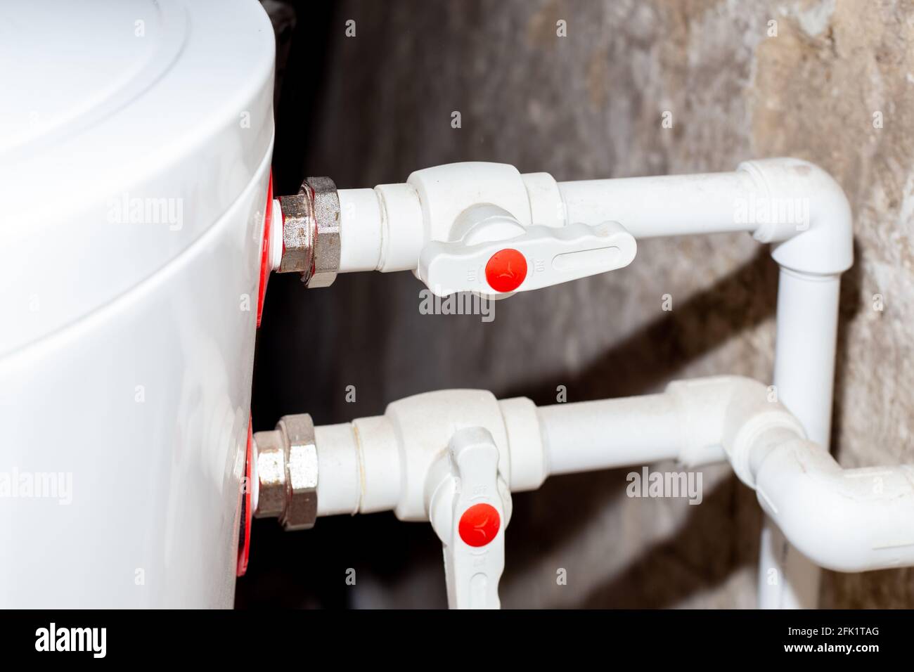 Boiler with two pipes that lead water from the fuel boiler and to the ...