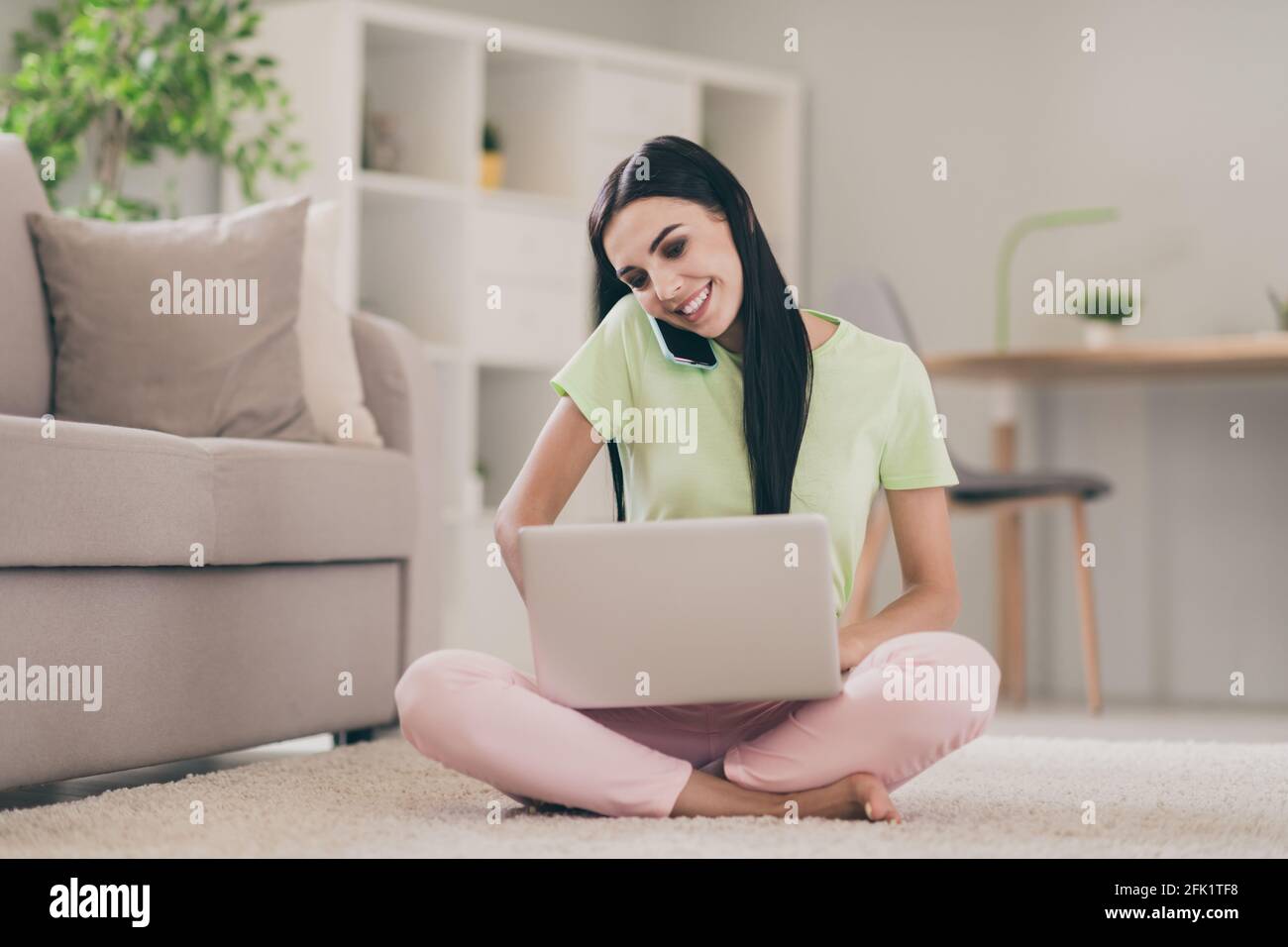 Portrait of charming cheerful focused girl sitting in lotus position ...