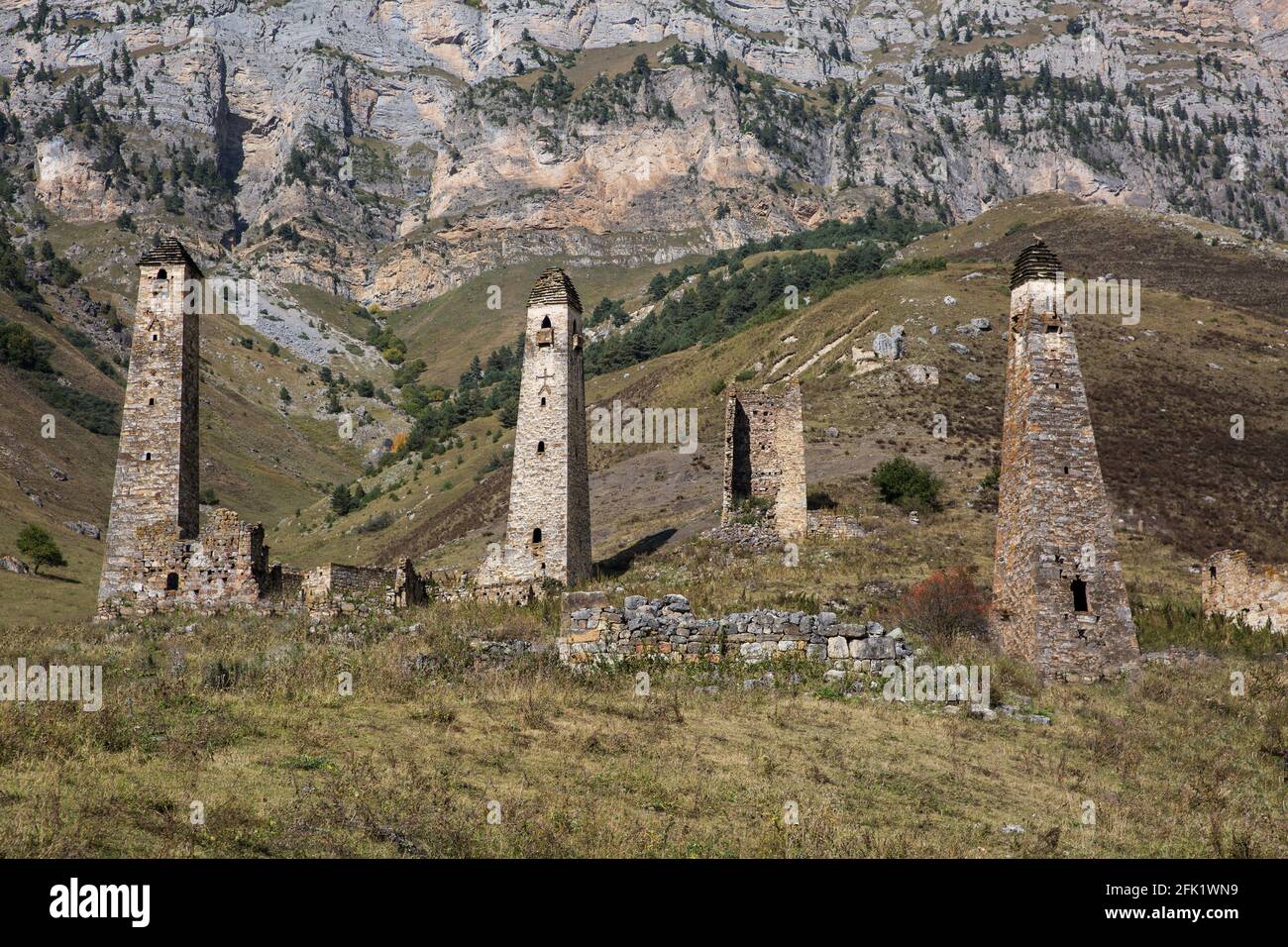 Landscape autumn view of medieval ancient stone battle tower complex in ...