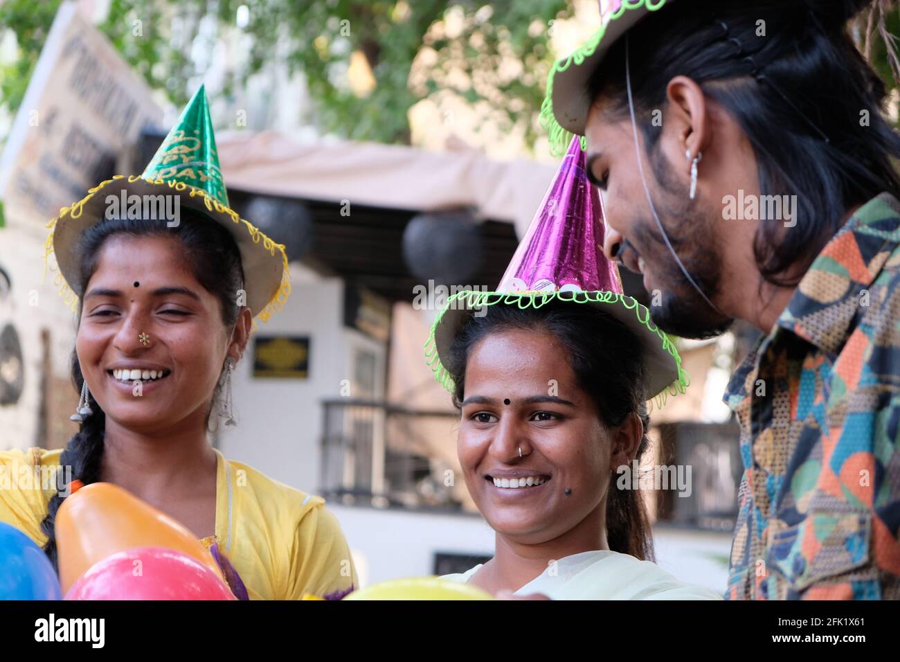 Happy smiling Indian friends having fun and enjoying the party outdoors ...