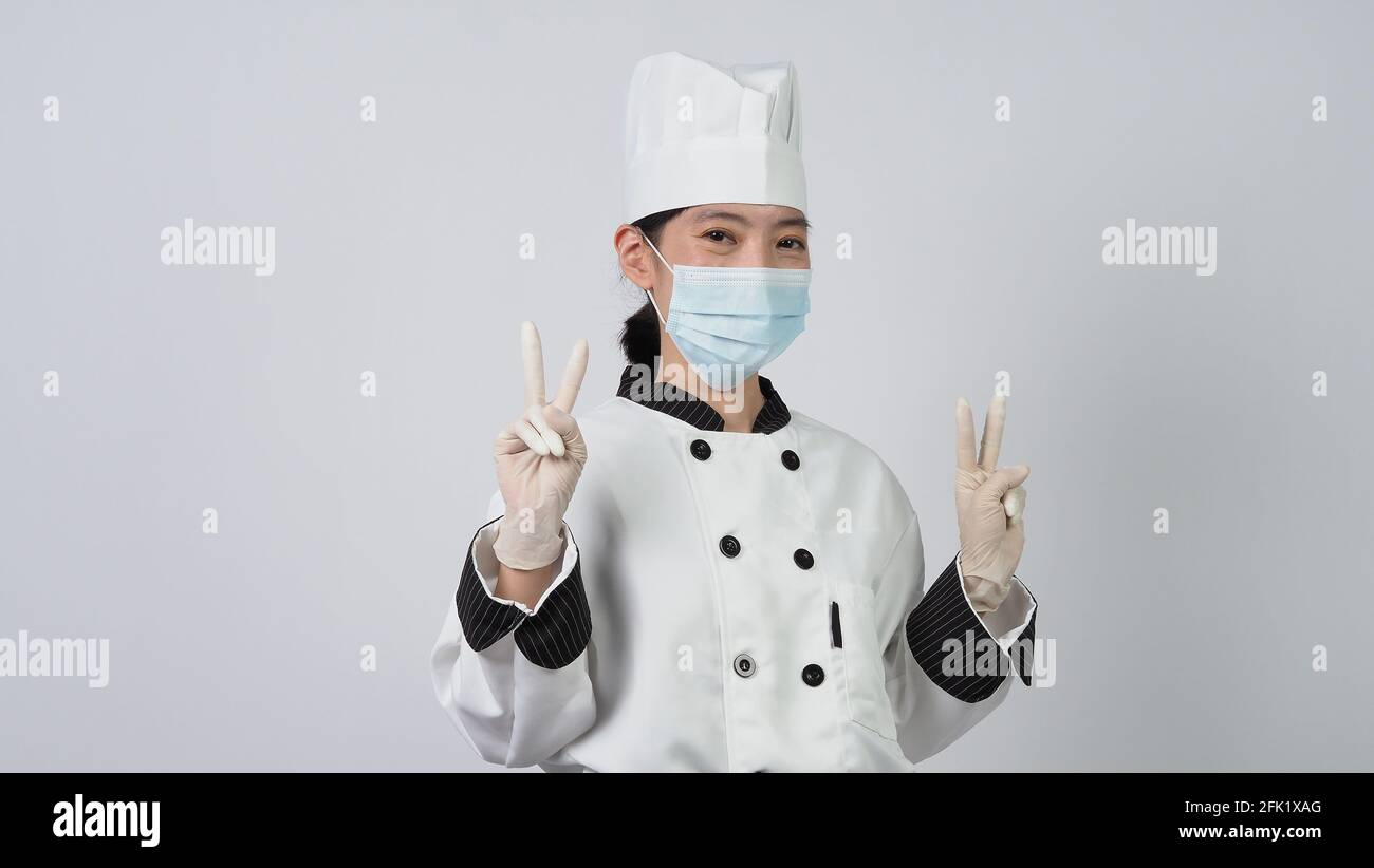 Chef wearing face protective medical mask or respirator for protection ...