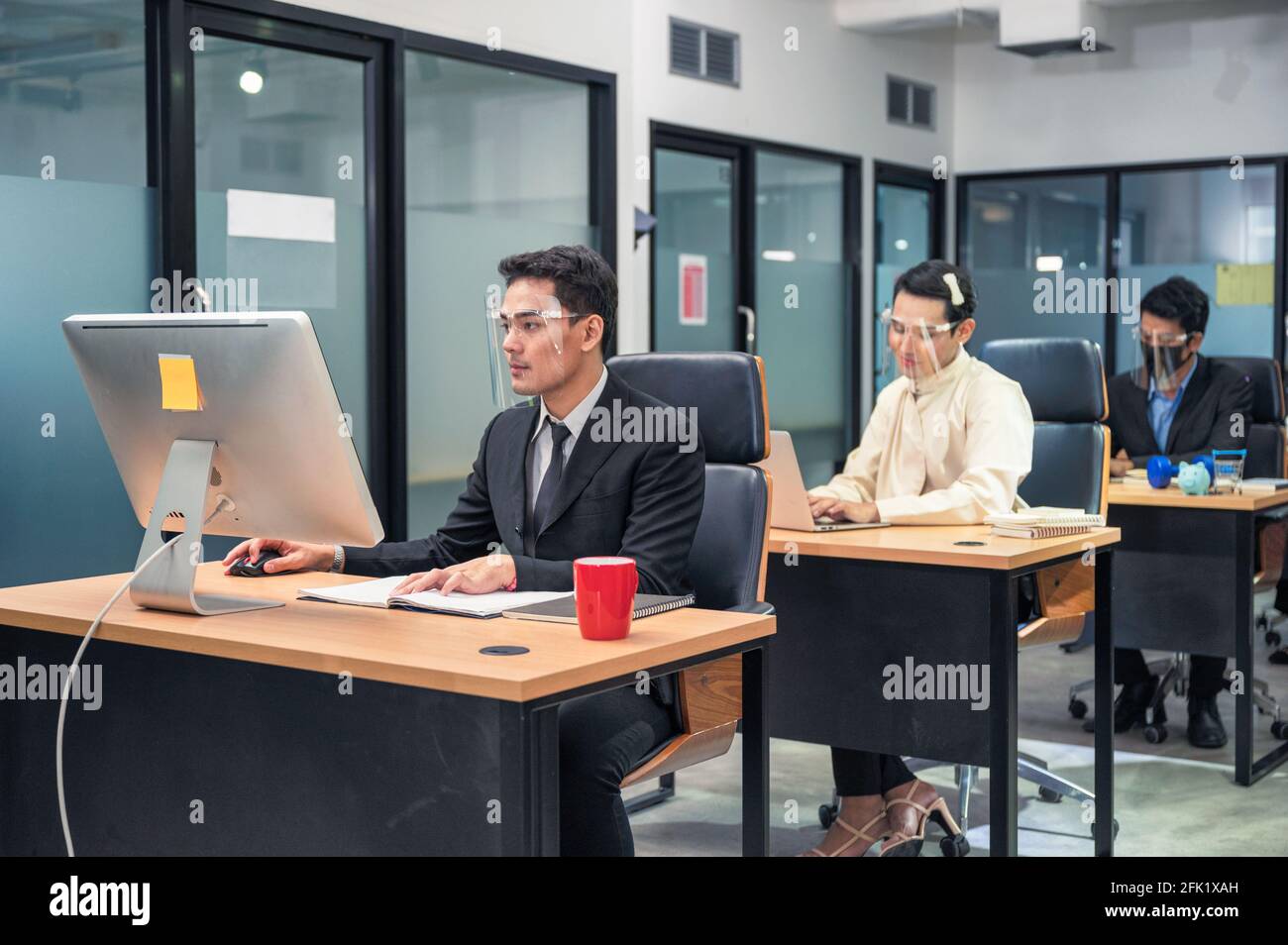 Group of office worker working with computer at desk in modern office ...