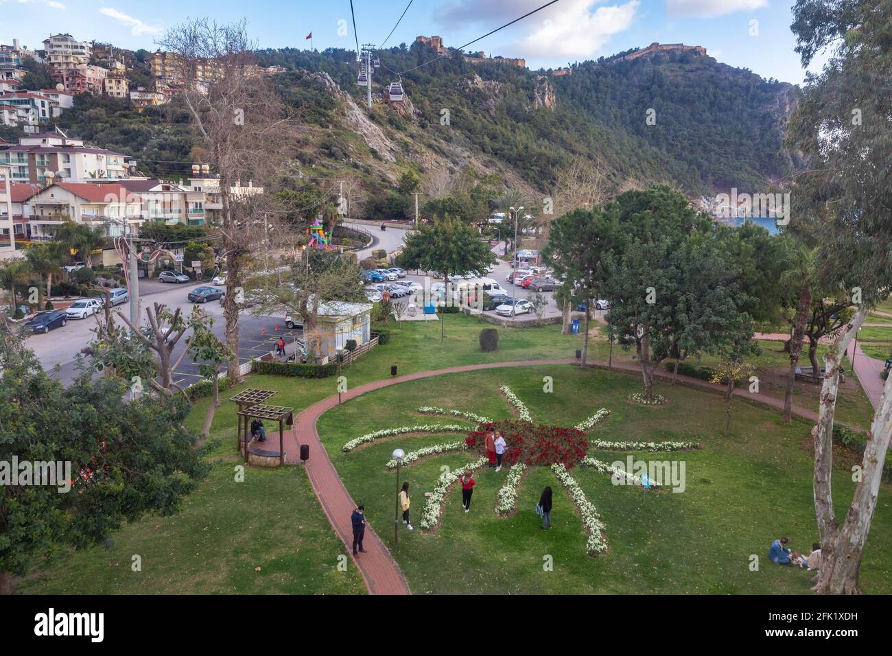 View of the Alanya cable car line and people in a park near Cleopatra ...