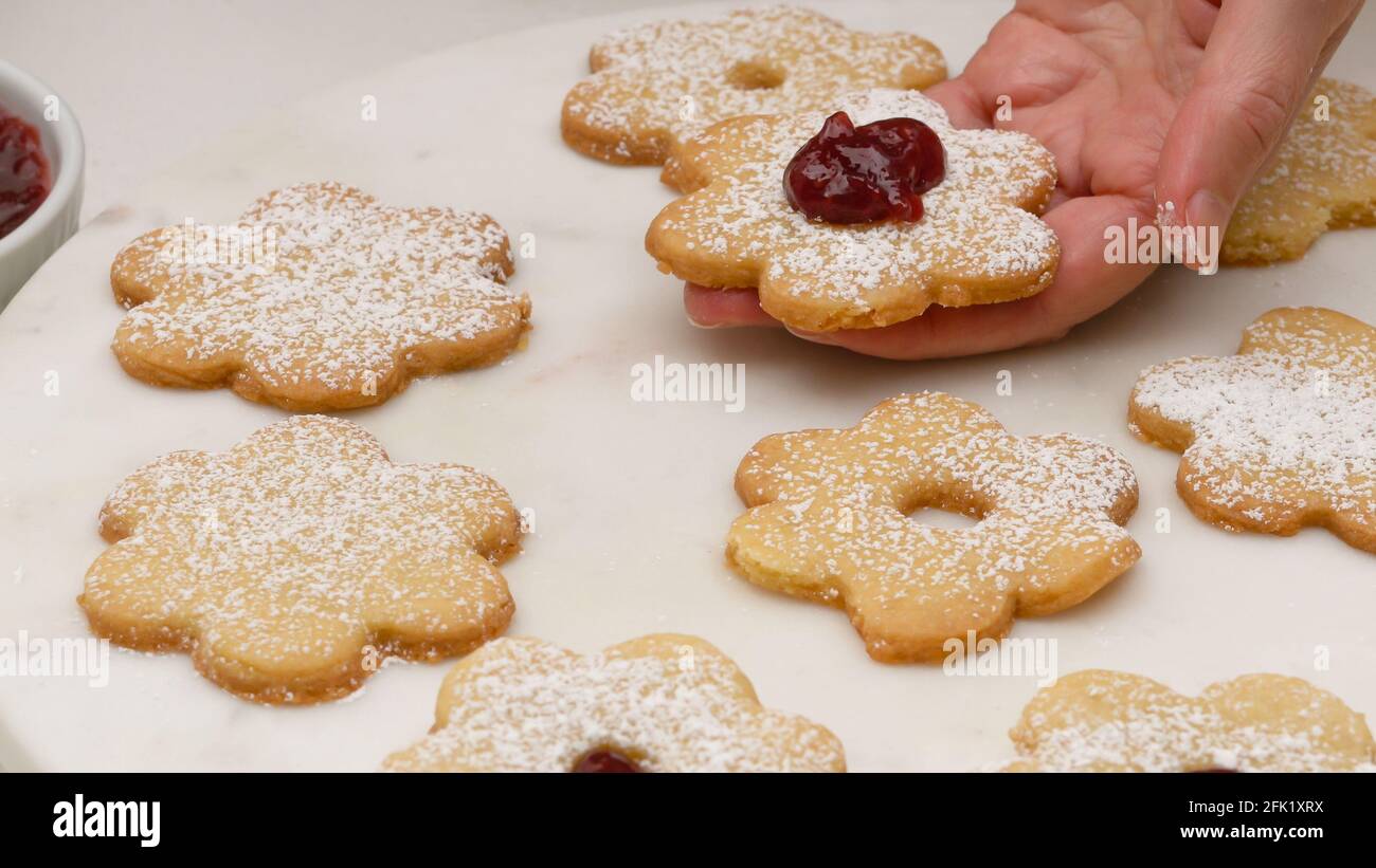 Flower shaped shortbread cookies filled with raspberry jam recipe ...