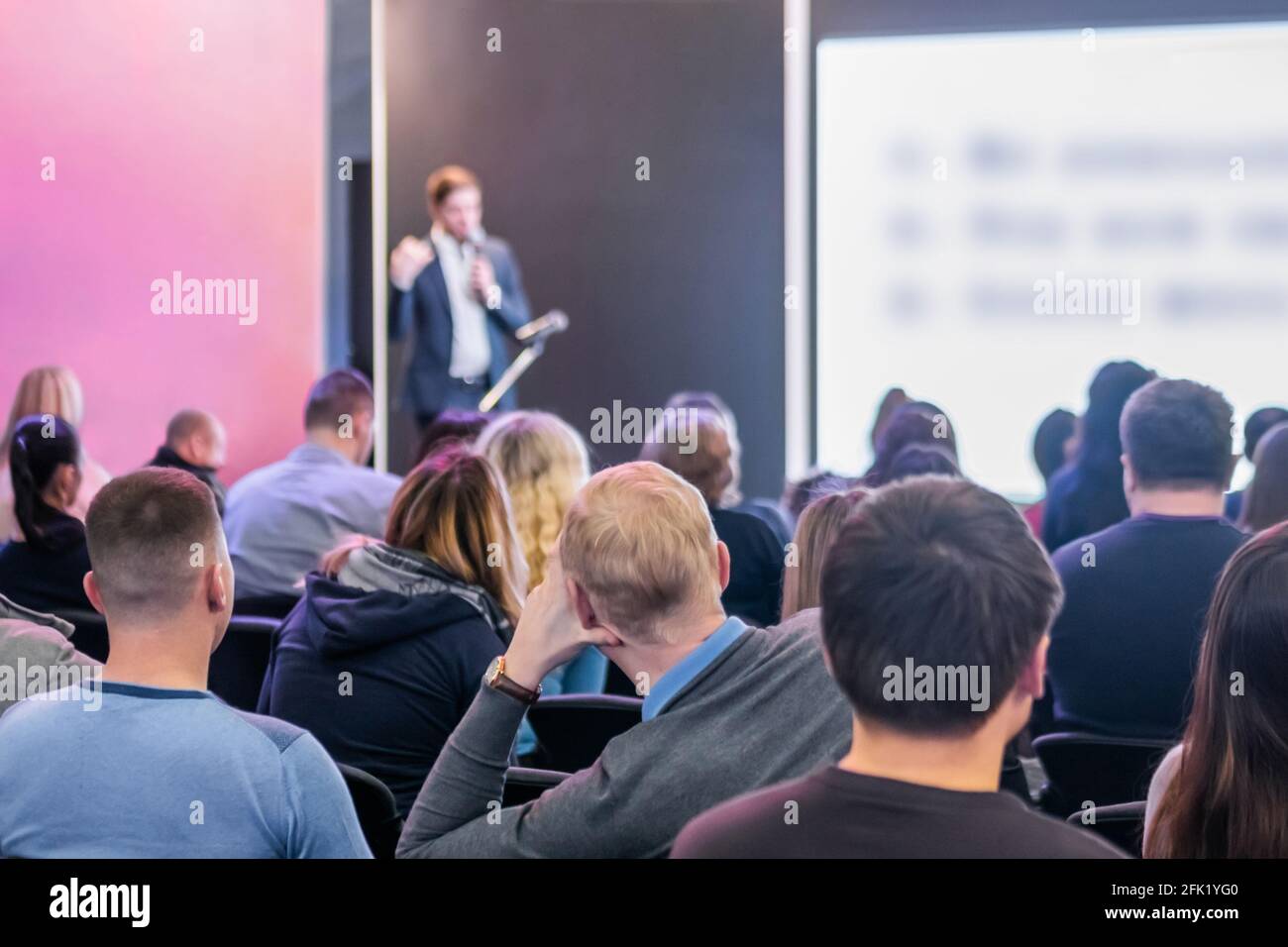 Back view of people listening presentation at conference hall Stock ...
