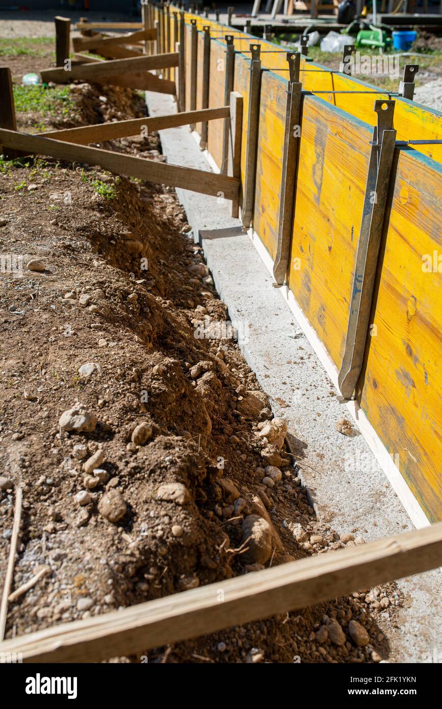 Construction site outside in backyard of a framework of wooden panels ...