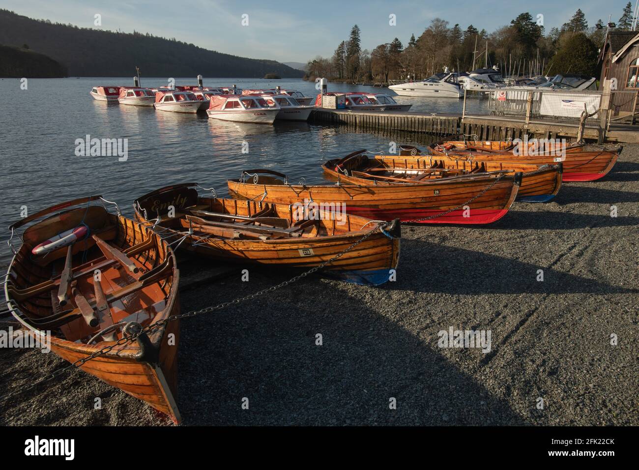 Lake cruisers and rowing boats in Bowness-on-Windermere lined up along ...