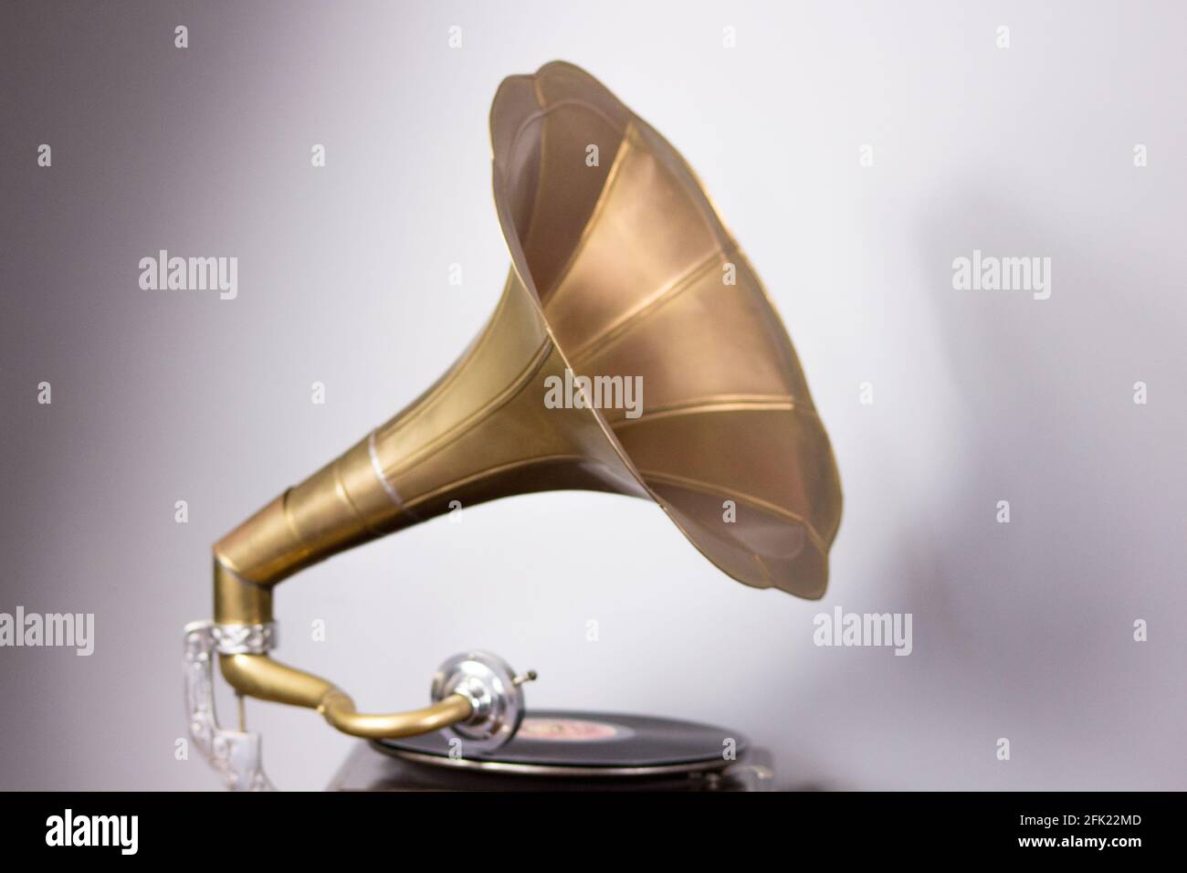 Old gramophone with a plate record. Portable wind-up gramophone ...