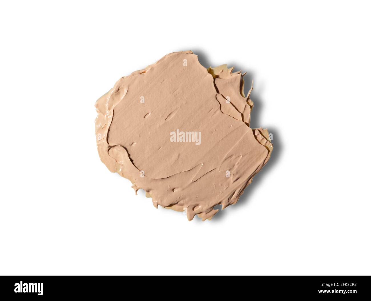 A smear of makeup foundation isolated on a white background. Swatch ...