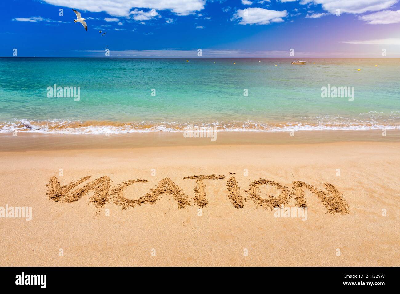 Vacation text on a beach. Vacation written in a sandy tropical beach ...