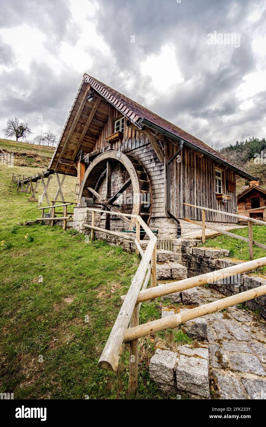 Eerie scenery of a wooden water mill in Kurpark Bad Wildbad, Germany ...