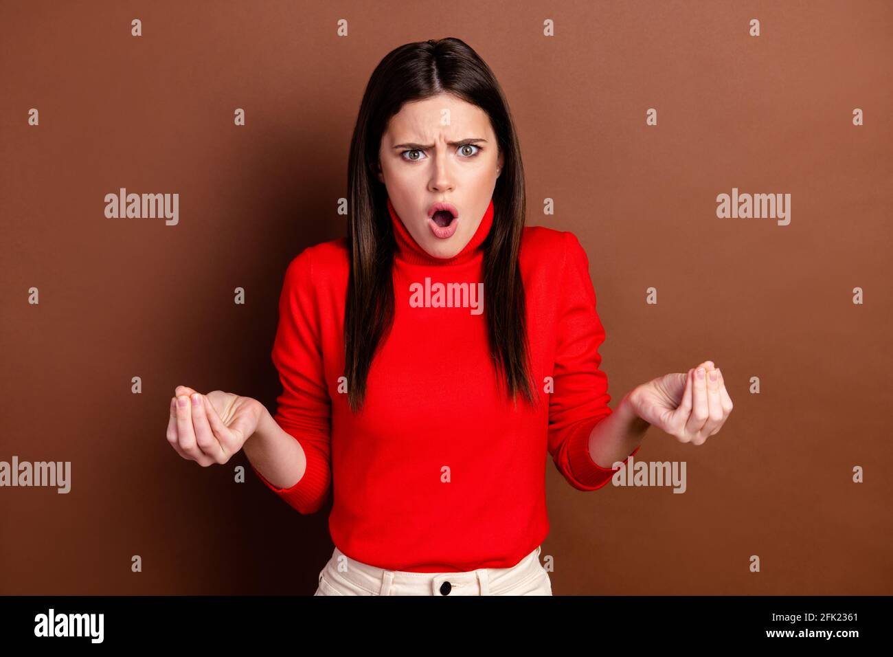 Photo of impressed angry young woman dressed red sweater ask understand ...