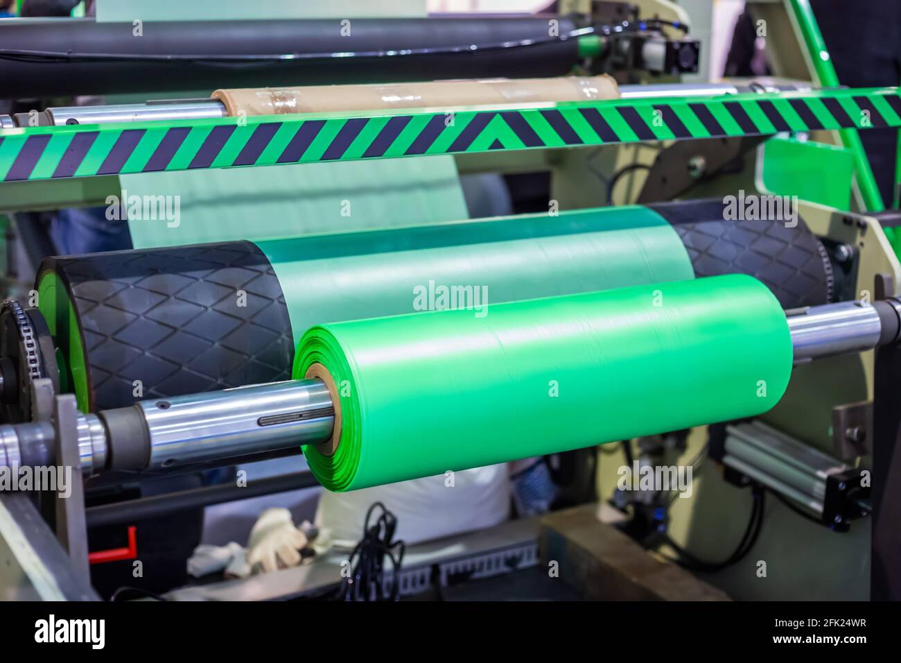 Automatic plastic bag making machine - roller with green polyethylene ...