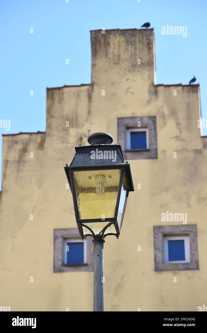 Street lamp in front of a medieval Gate tower Stock Photo - Alamy