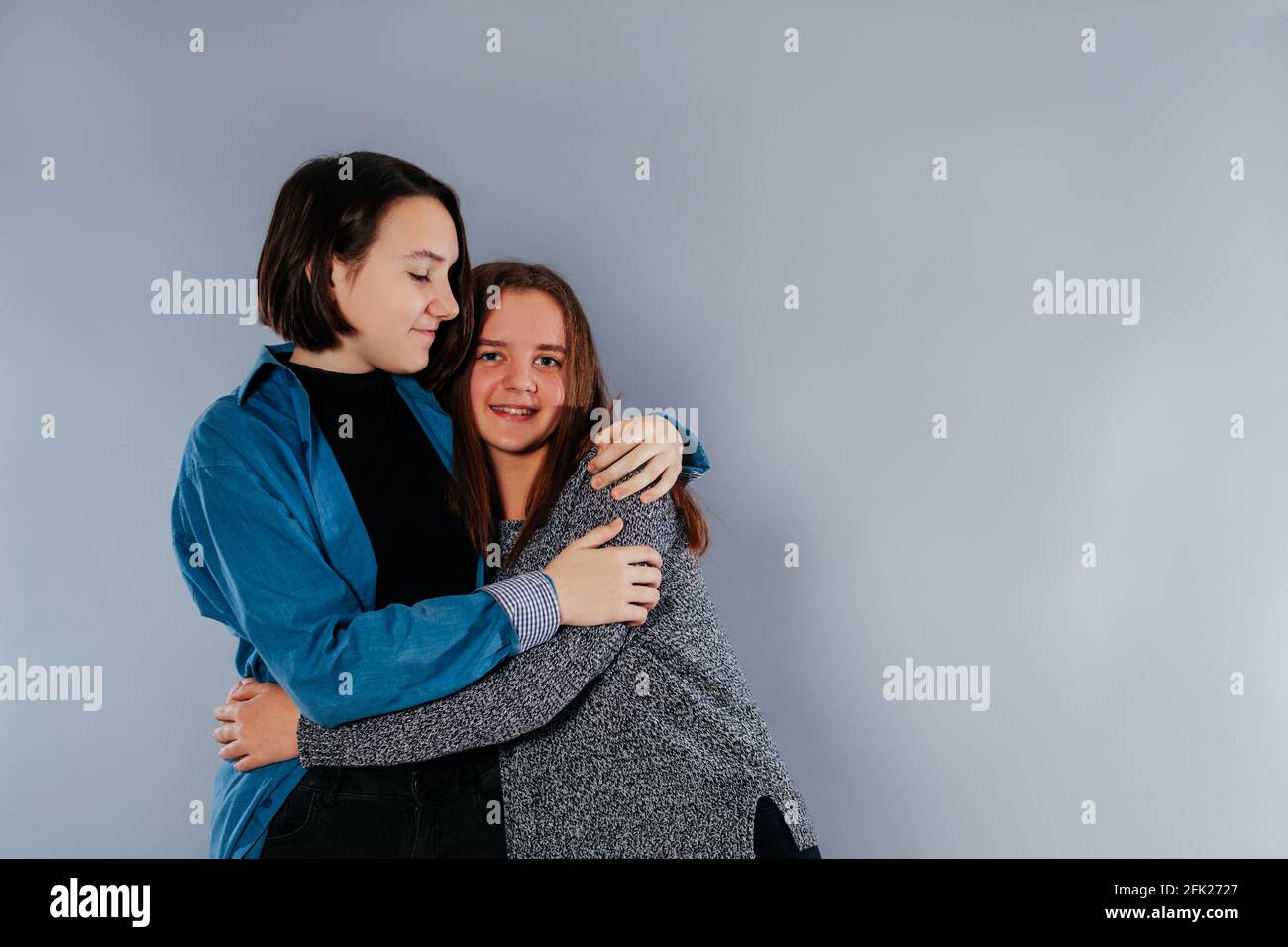 Two teenage sisters are hugging each other Stock Photo - Alamy Two teenage sisters are hugging each other Stock Photo - Alamy