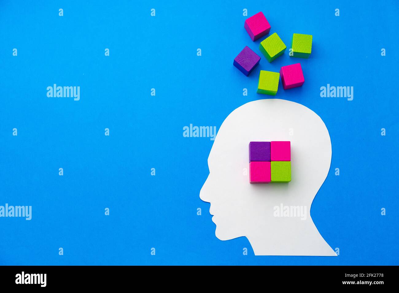 Papercut silhouette of human head with colorful constructor pieces ...