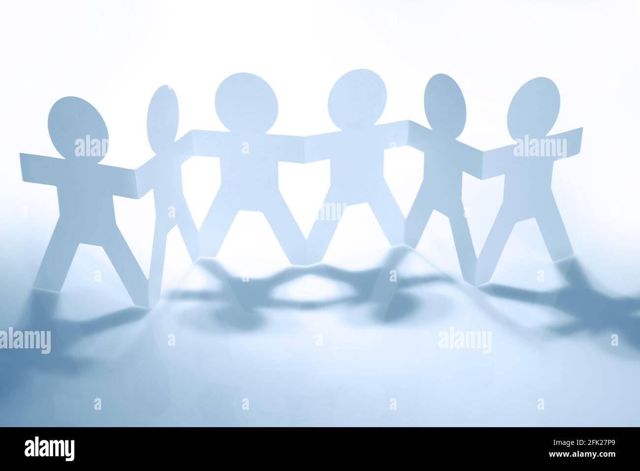 Team of paper chain people Stock Photo - Alamy