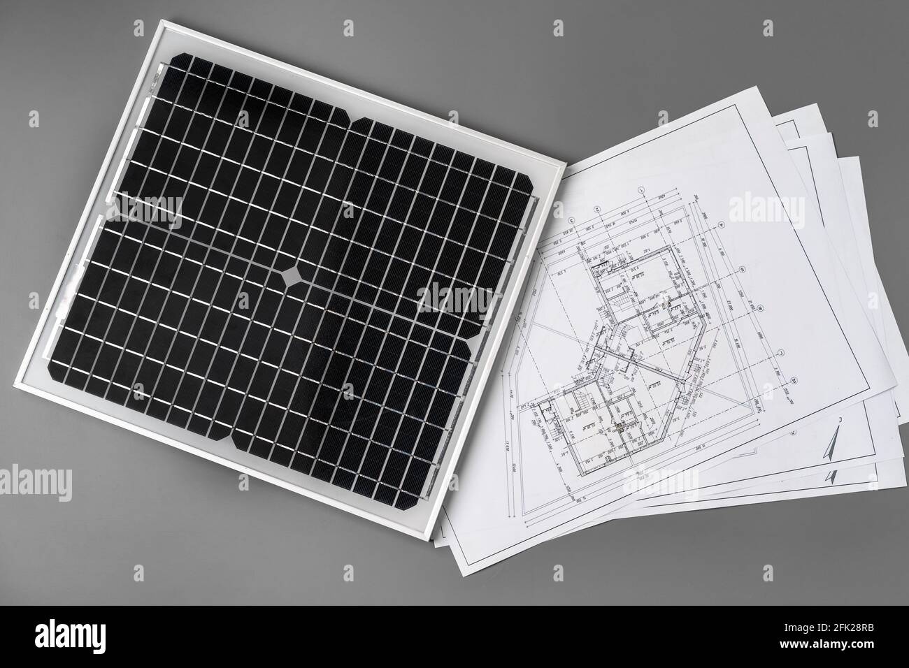 Architectural blueprints and solar panel on table Stock Photo - Alamy