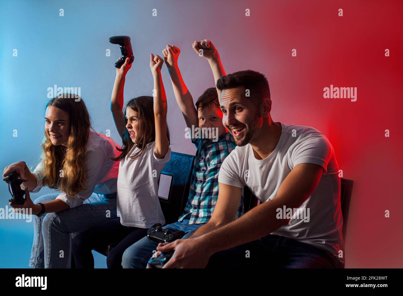 Group of friends together start virtual game Stock Photo - Alamy