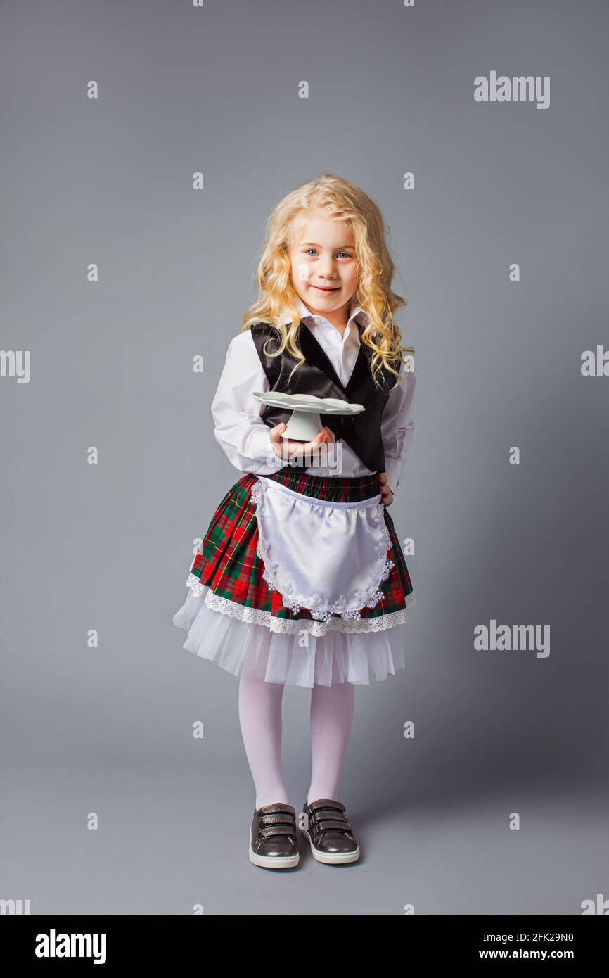 The happy little waitress with a tray Stock Photo - Alamy
