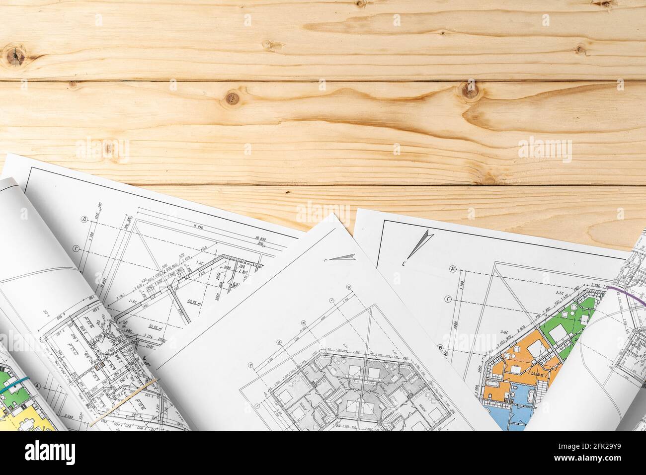 Architectural construction plans paper on table close up Stock Photo ...