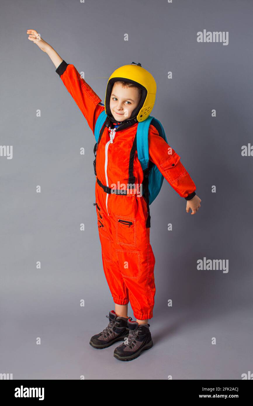 The little boy is posing in a parachute costume Stock Photo - Alamy
