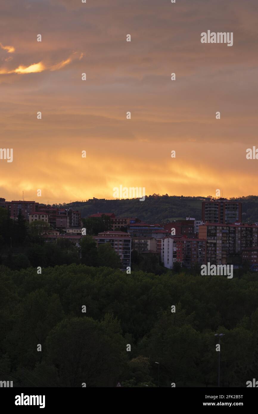 Beautiful orange sunset sky over the city buildings Stock Photo - Alamy