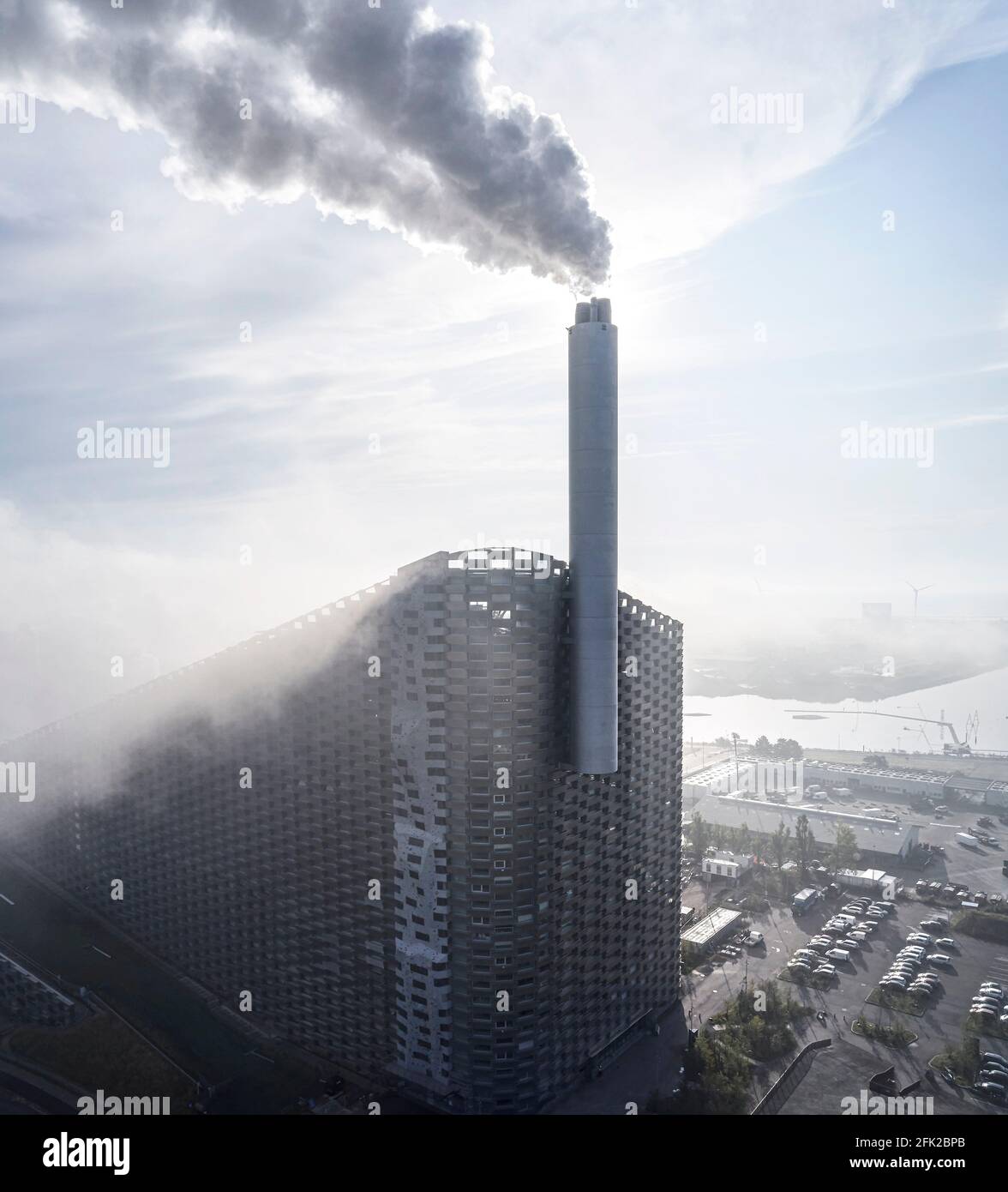 View with clouds, facade and context. CoppenHill Power Plant ...