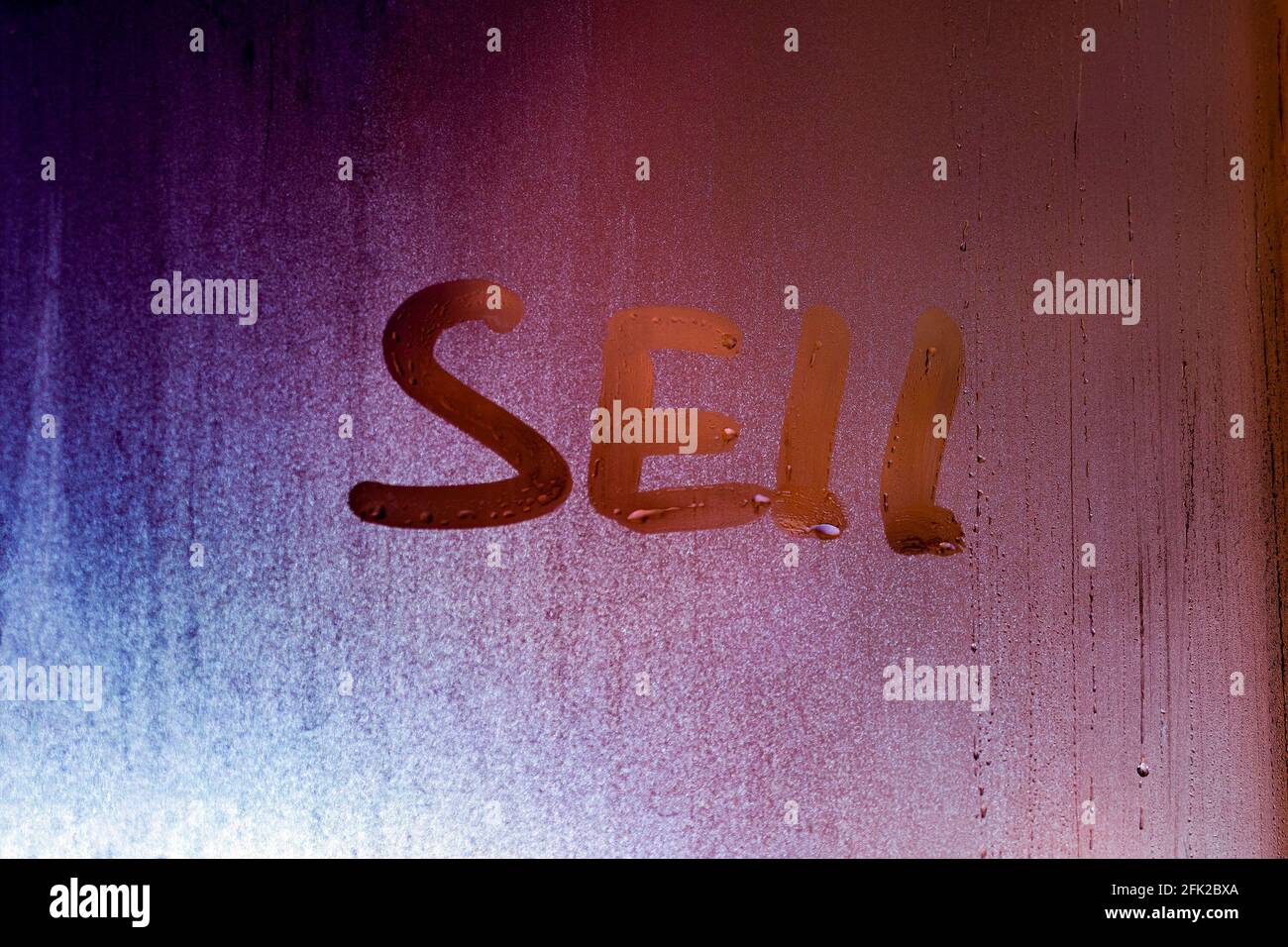 the word sell handwritten on night wet window glass surface Stock Photo ...