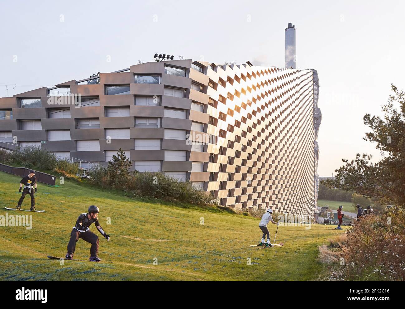 Green skiing slope juxtaposed to exterior facade. CoppenHill Power ...