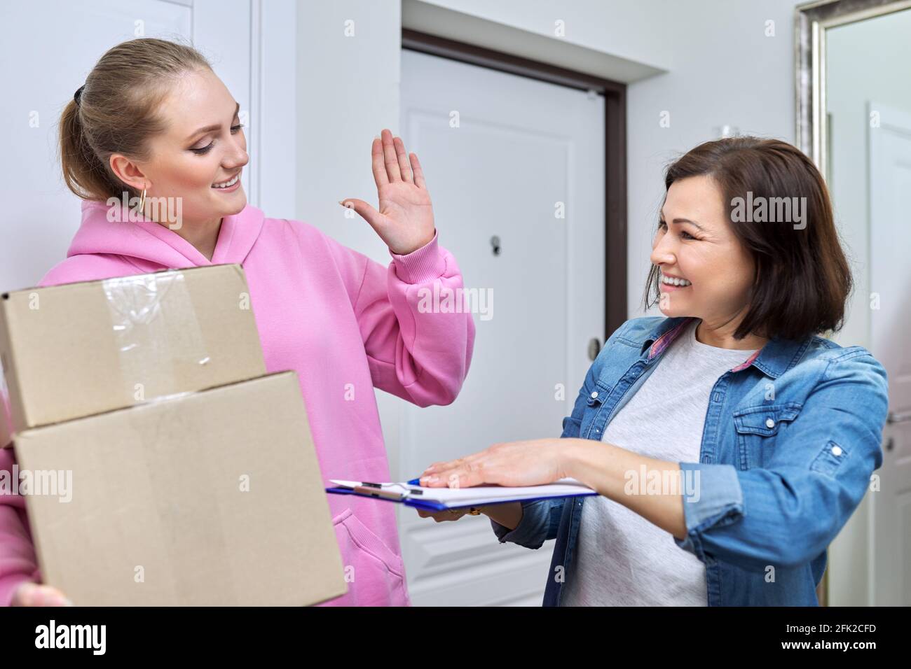 Online shopping delivery service, courier young woman with cardboard ...