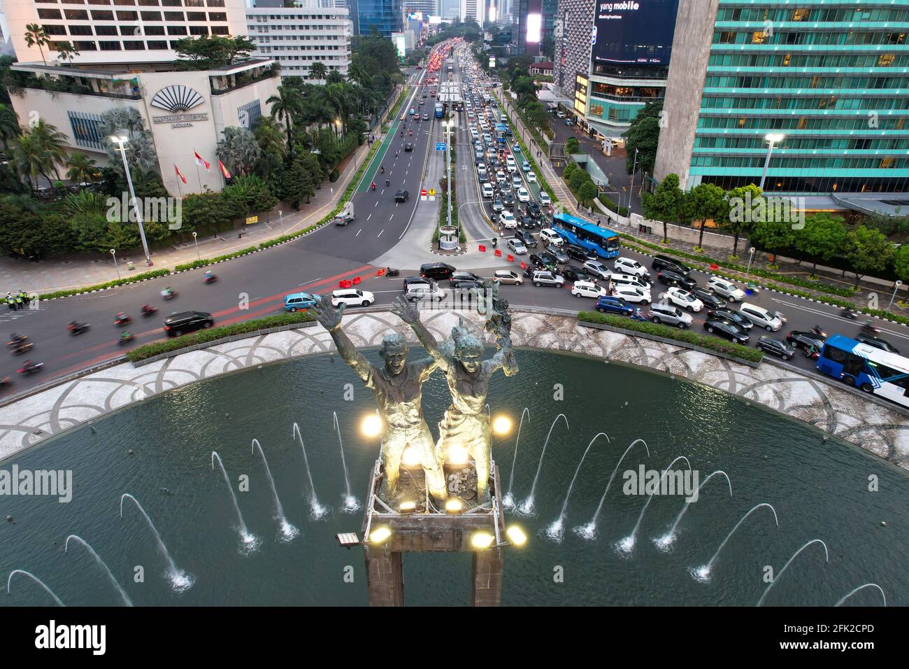 Aerial view of the city traffics at the Hotel Indonesia Roundabout ...