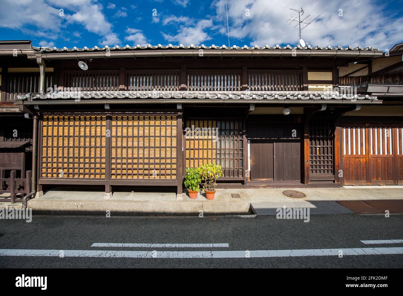 Traditional Japanese building architecture with green plant in ...