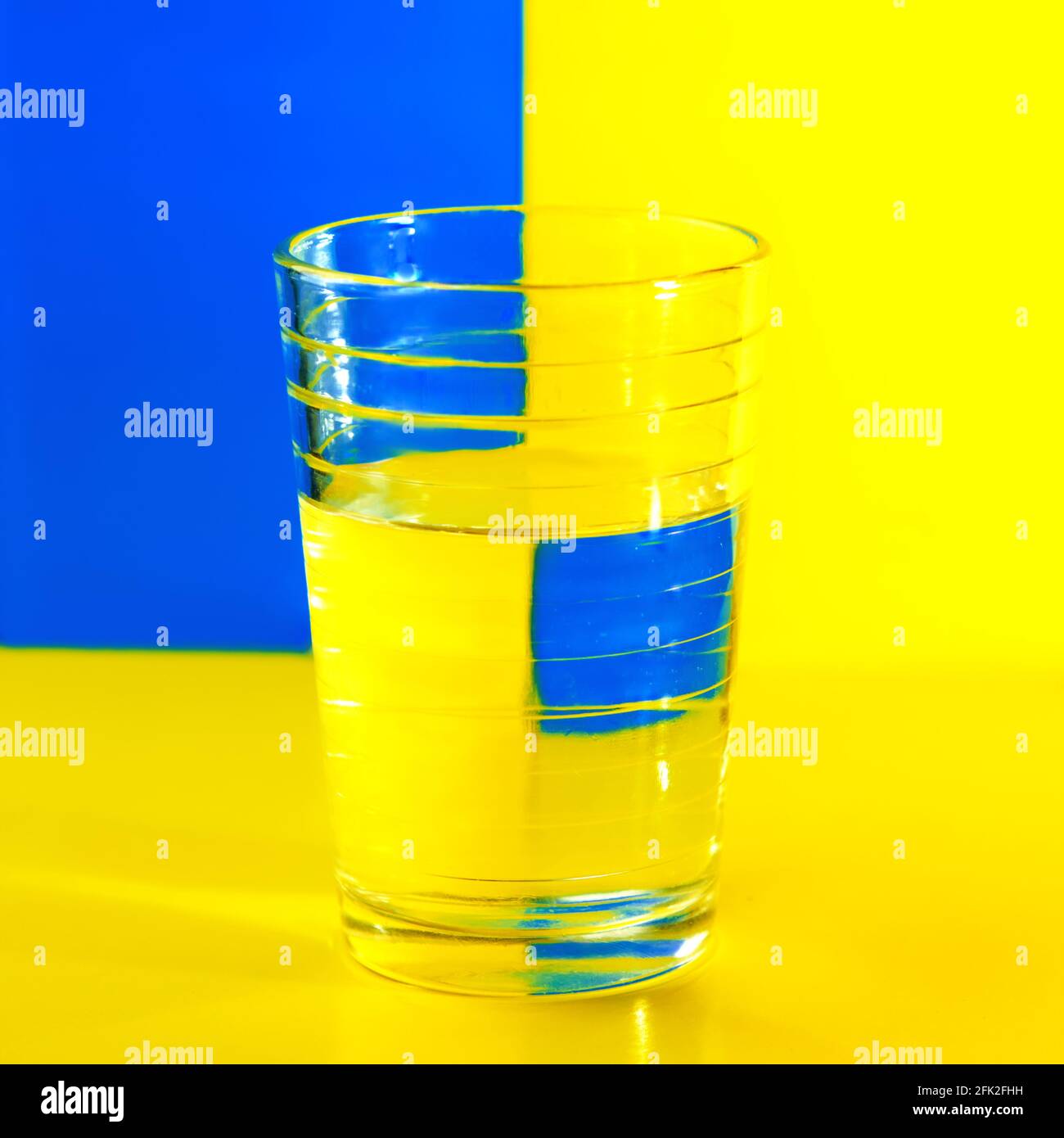 Split water reflection dividing the colors yellow and blue Stock Photo ...