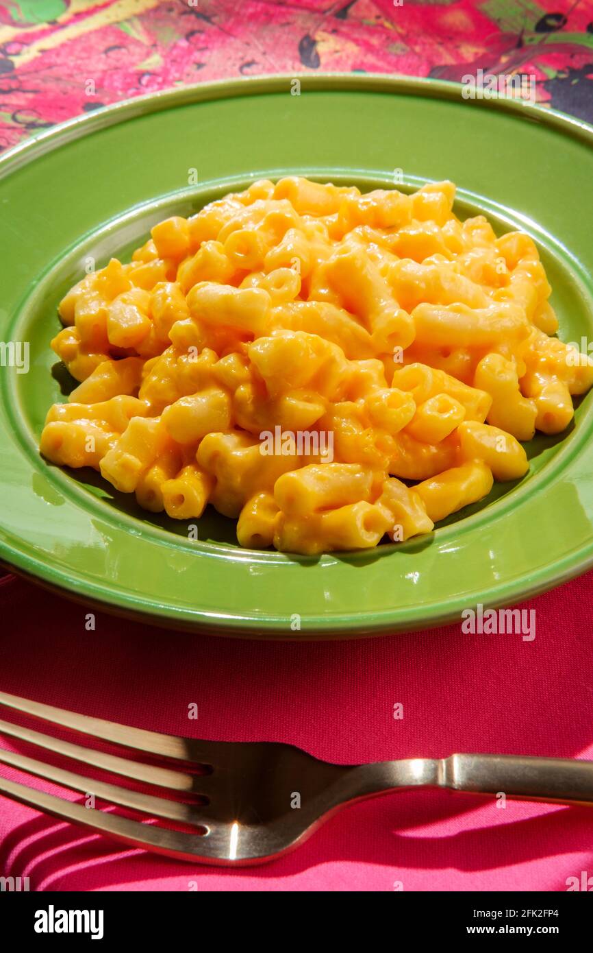Stylized pop fashion macaroni and cheese on abstract pink background ...