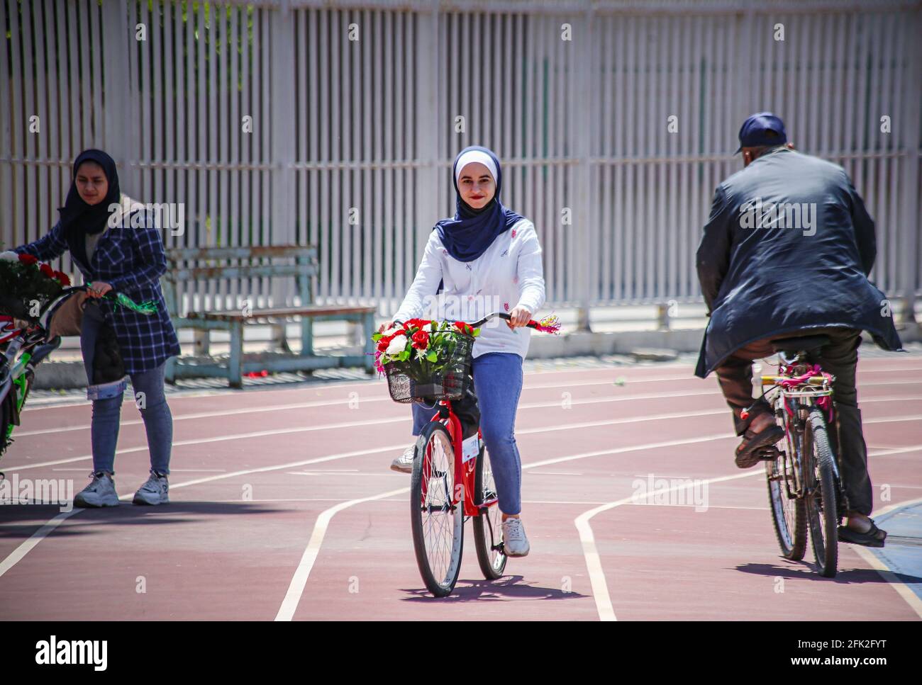 Gaza city, The Gaza Strip, Palestine. 27th Apr, 2021. Palestinian woman ride bike with the pink ...