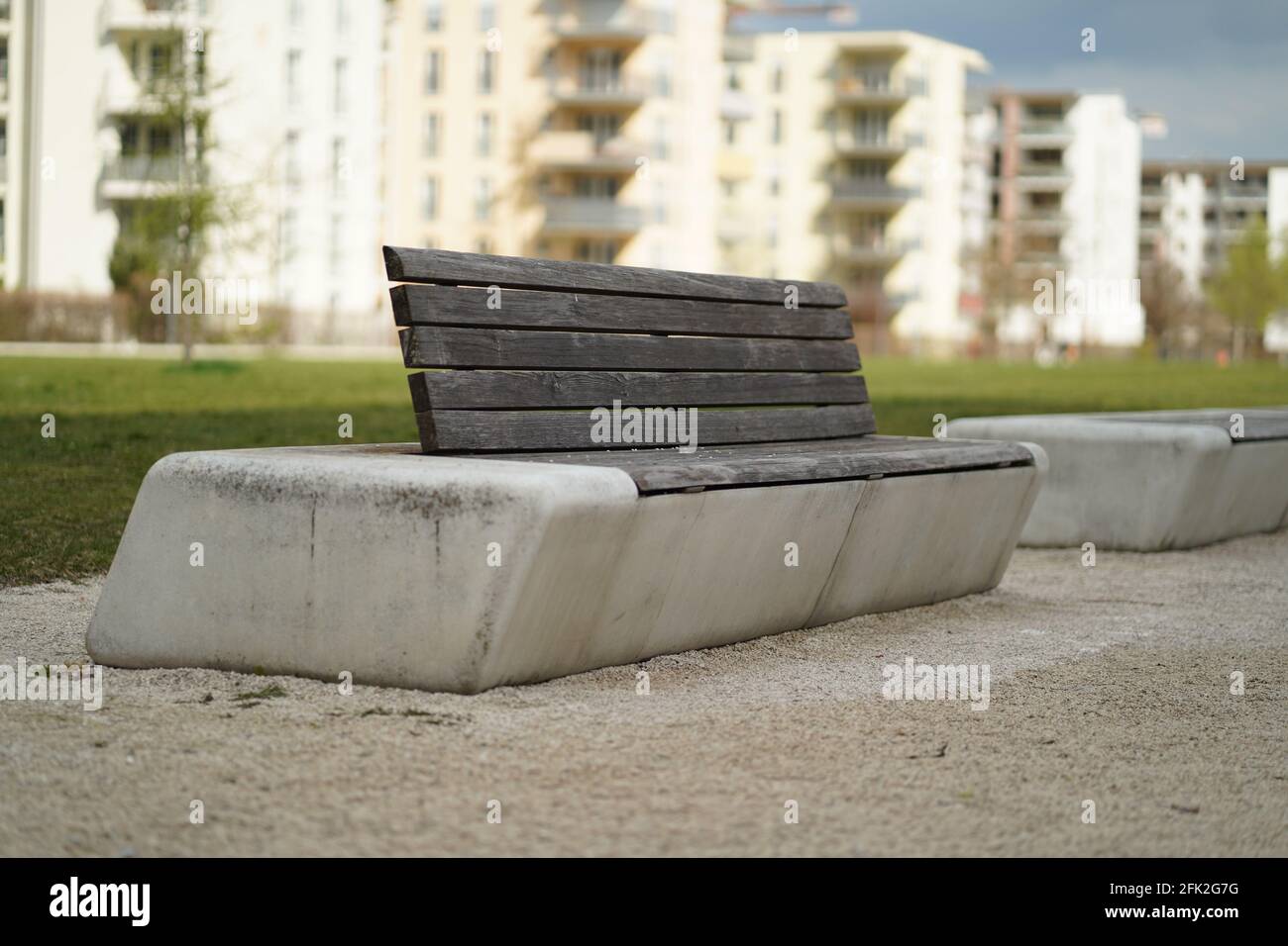 Selective focus of urban abstract wooden benches installed in stone ...