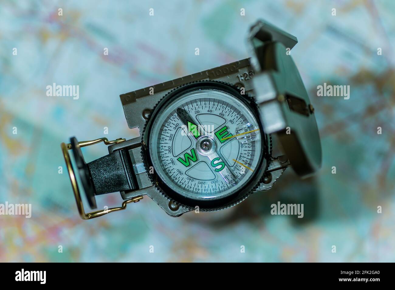 Top view of a modern navigation metal tourist compass Stock Photo - Alamy