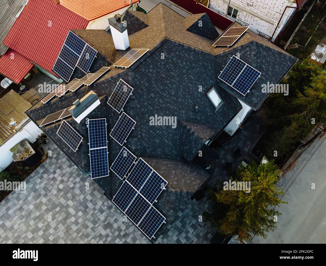 Aerial view of solar photovoltaic panels on a own house roof in small ...